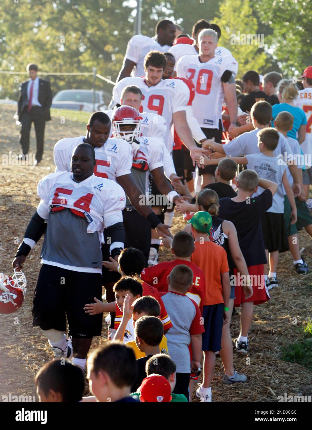 Kansas City Chiefs center Brian Waters (54) and other players greet ...