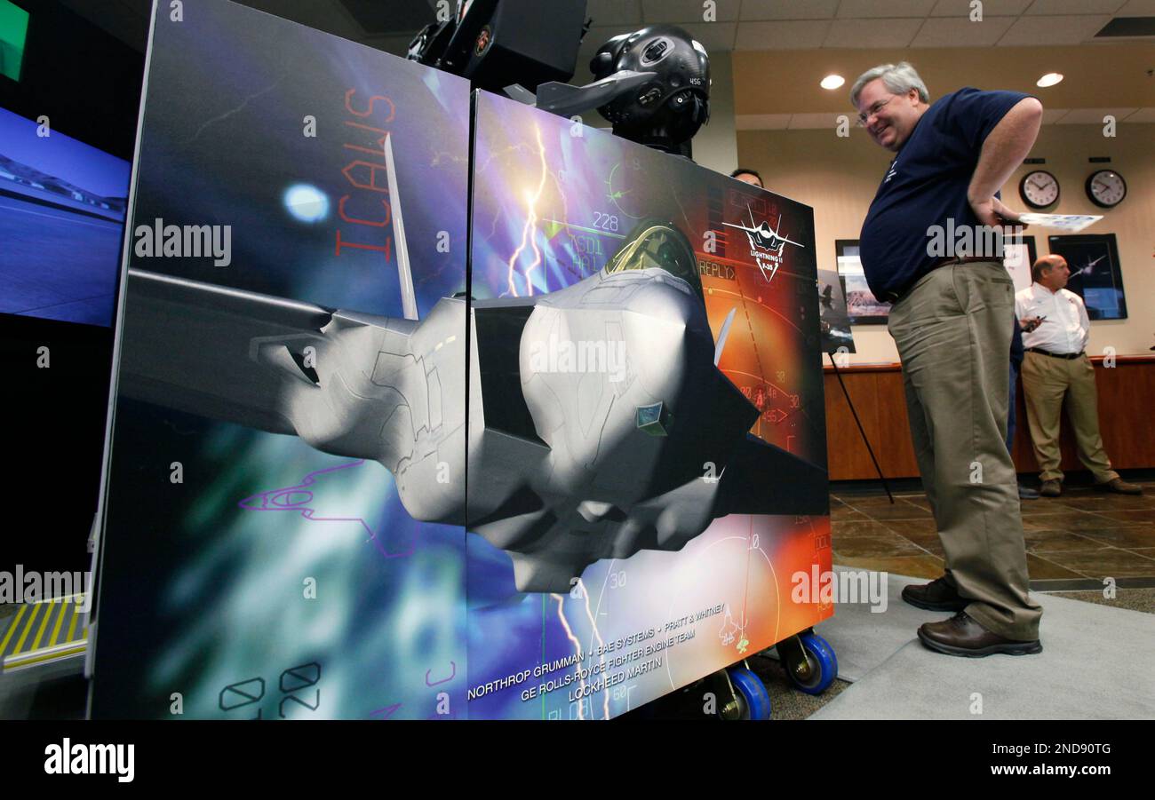 Fatigue Technology Inc. employee Doug Glenn smiles as he looks over an ...