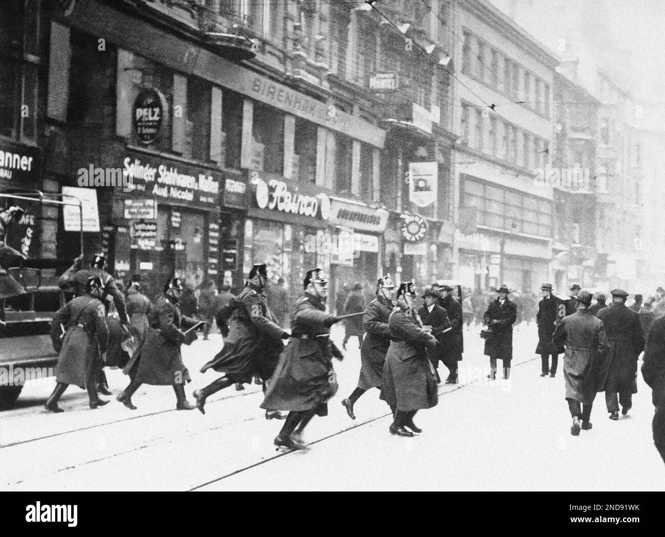 Police chase anti communist rioters in Berlin Jan. 22, 1933. (AP Photo ...
