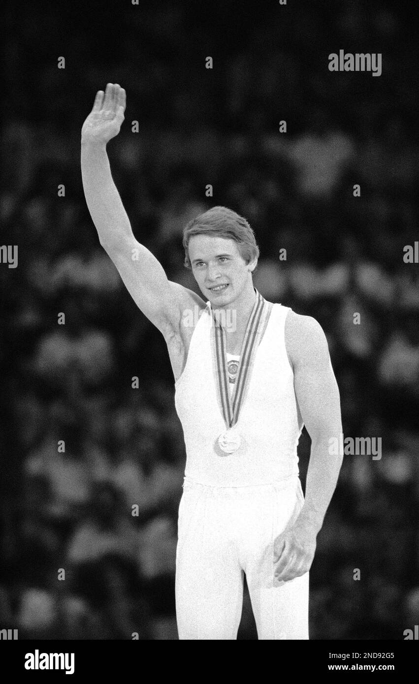 Soviet gymnast Alexander Dityatin waves to audience in Moscow Thursday ...