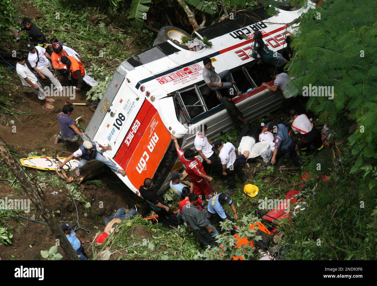 Rescuers and paramedics remove passenger victims from the wreckage ...