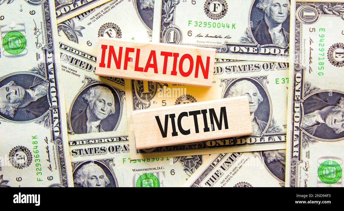 Inflation victim symbol. Concept words Inflation victim on wooden block ...