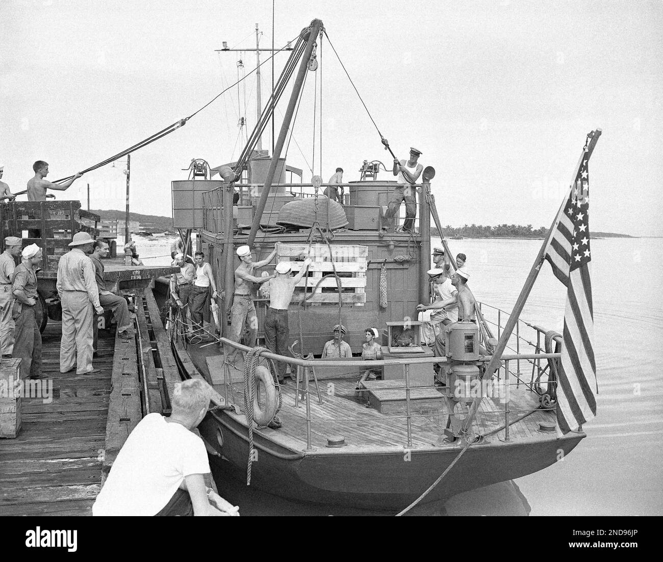 Navy supply boat is source of great interest as she unloads at this ...