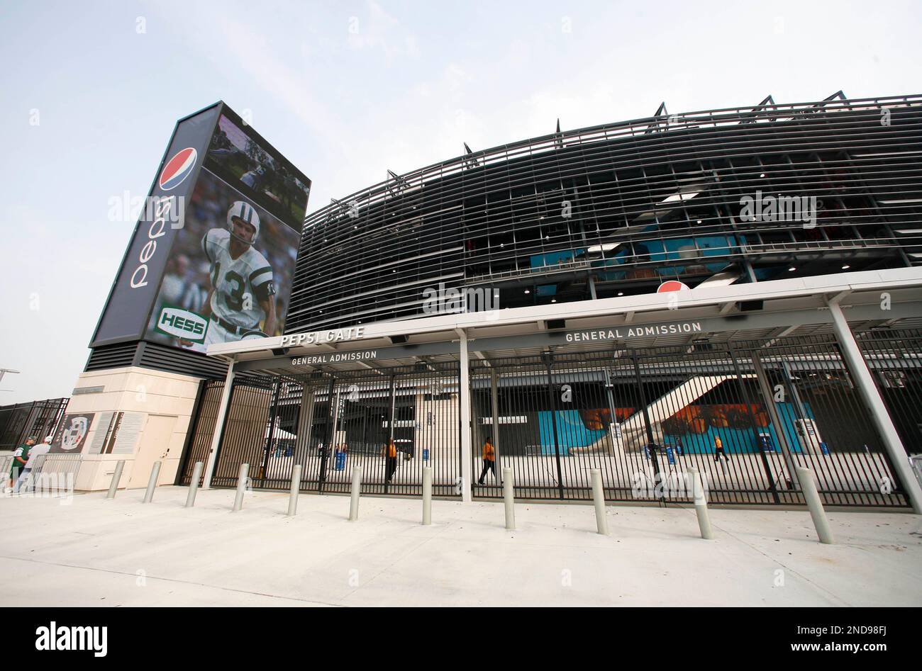 Staff behind the entrance gates at New Meadowlands Stadium prepare for ...