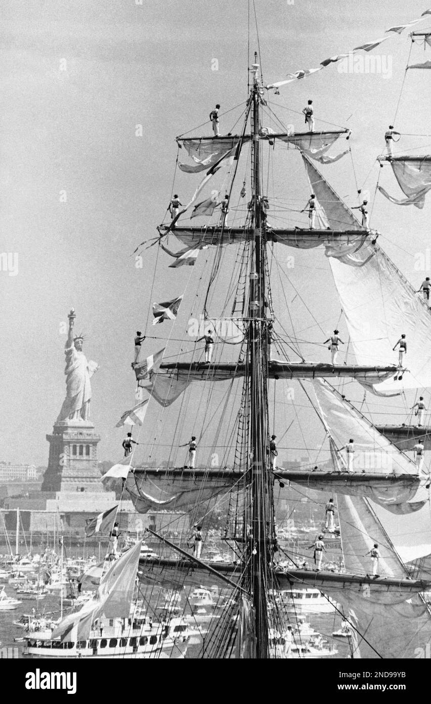 The tall ship Danmark, with her crew high in the rigging, passes the ...