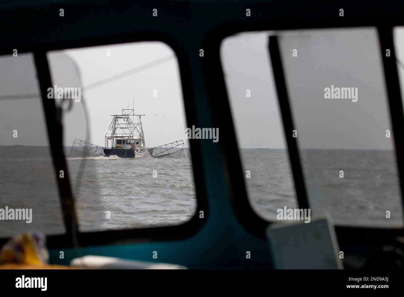 A shrimp trawler is seen from the cabin of the trawler 'Rolling Thunder ...