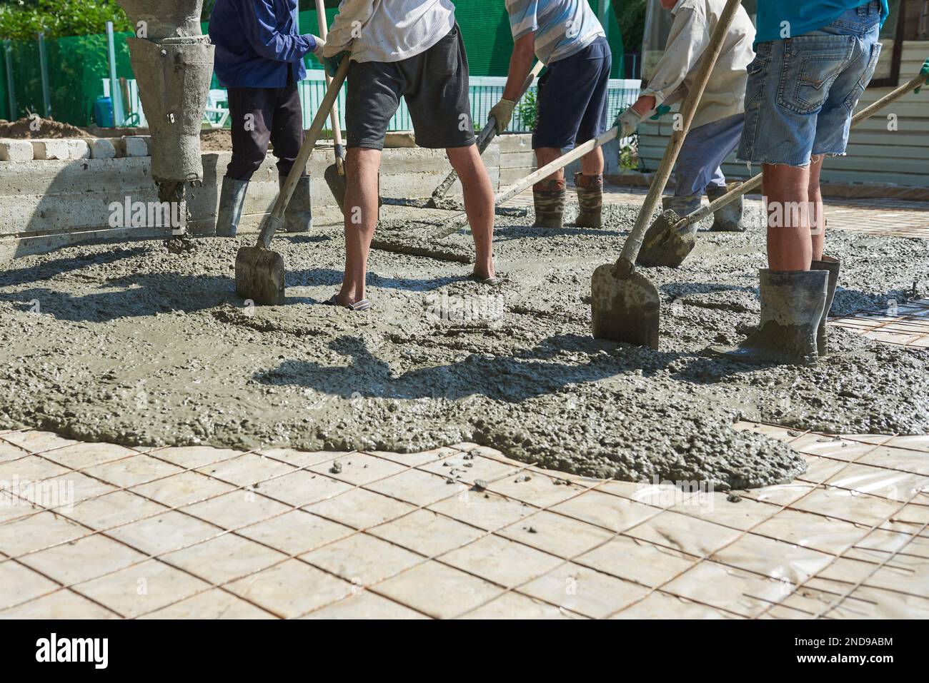 A group of labor concreting the yard Stock Photo - Alamy
