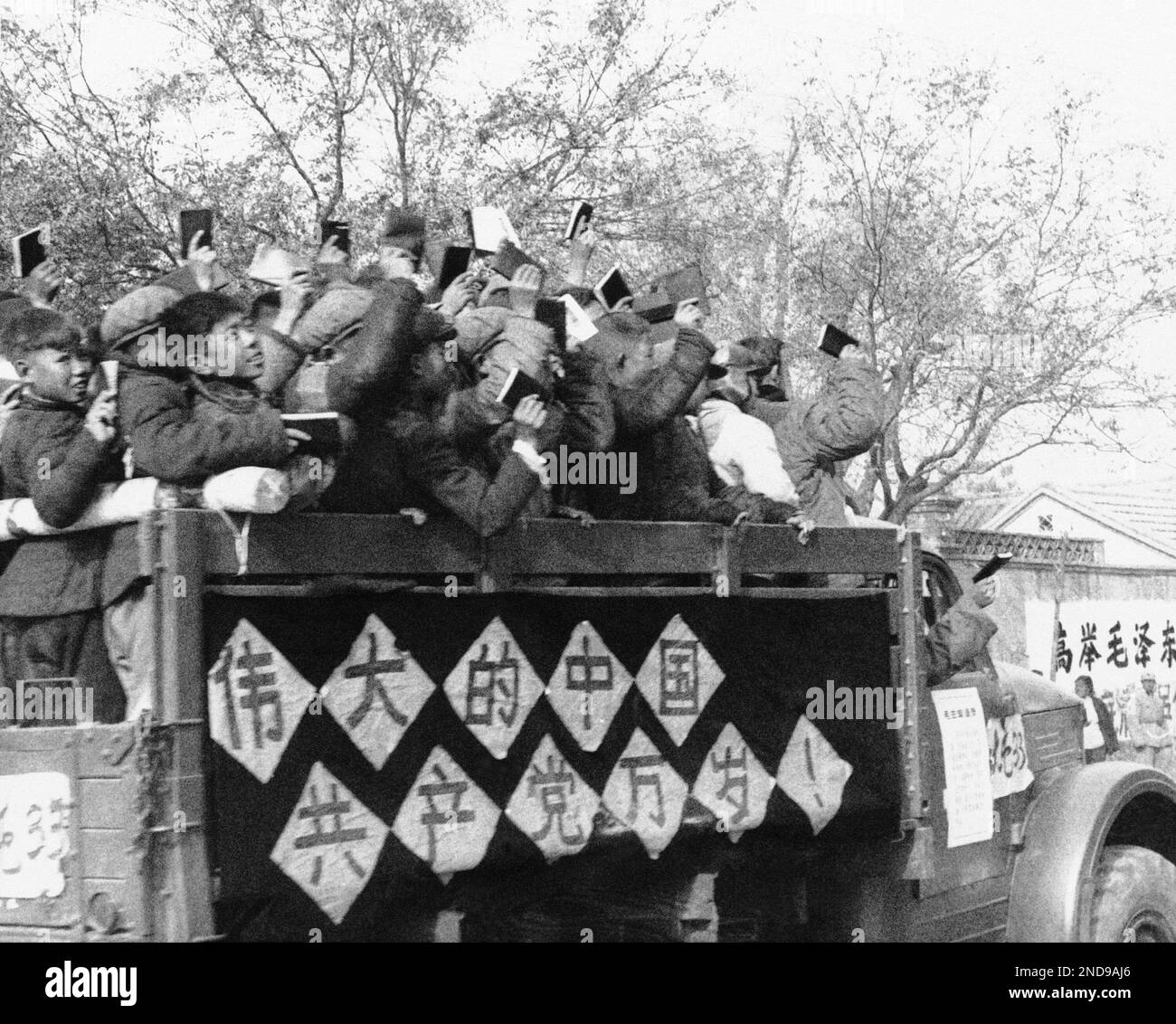 Truck loaded with Red Guards demonstrators rolls through the streets of ...