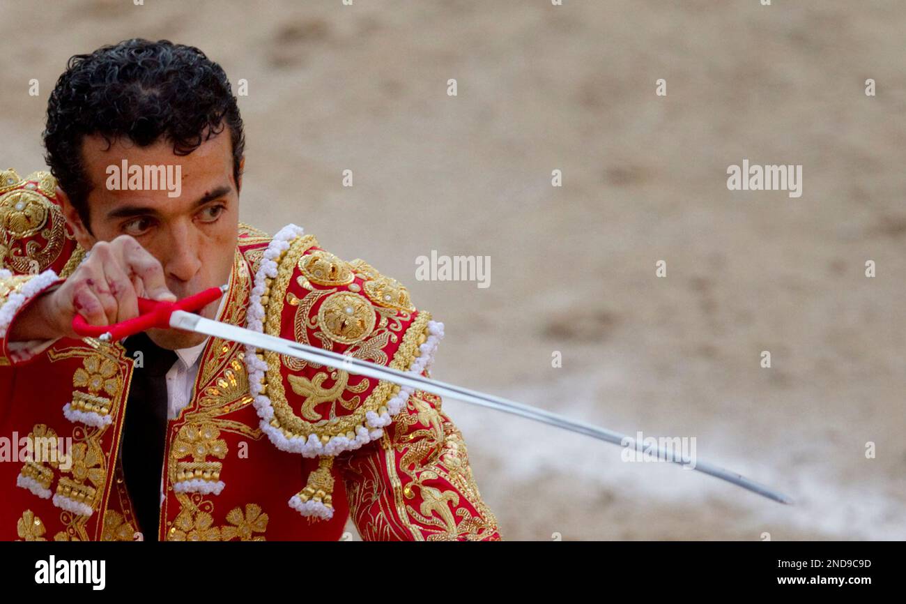 Spanish bullfighter Victor Puerto holds his sword during a bullfight at ...