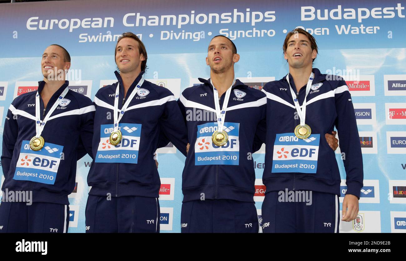 France's team show off their gold medals after the Men's 4x100m medley ...