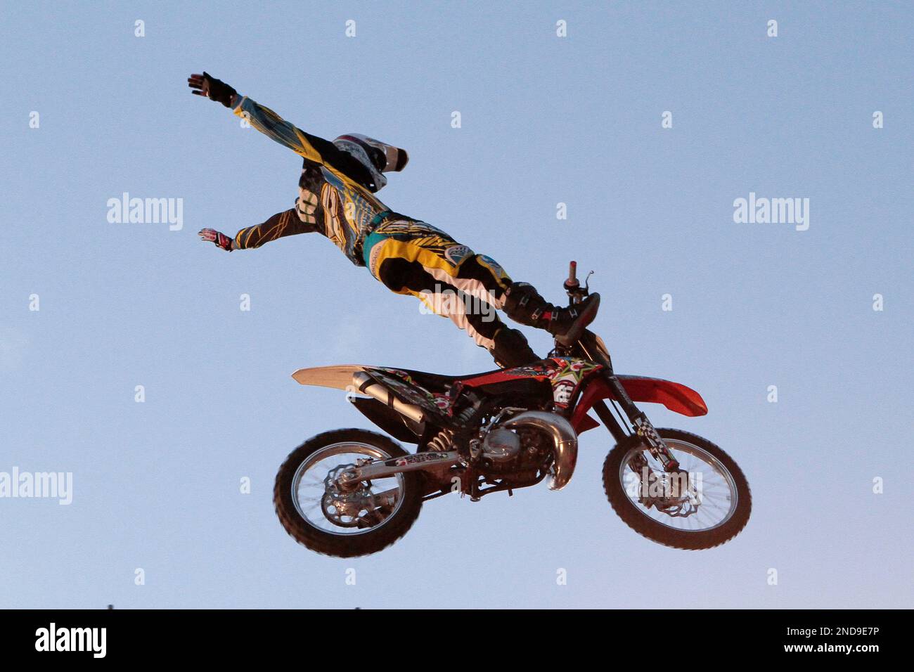In this Saturday, Aug. 14, 2010, photo a motocross rider, no name given ...