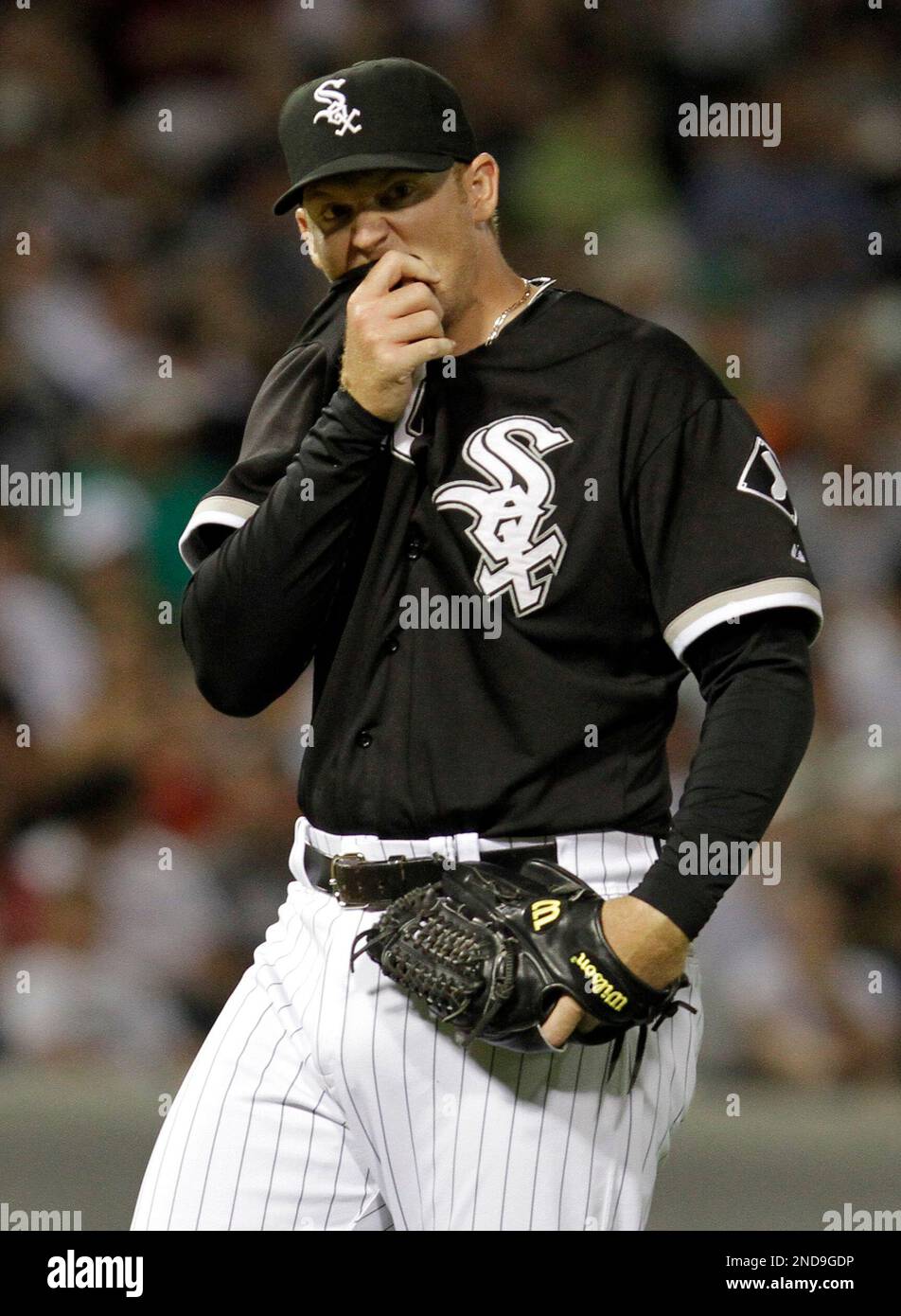 Chicago White Sox relief pitcher J.J. Putz wipes his face during the ...