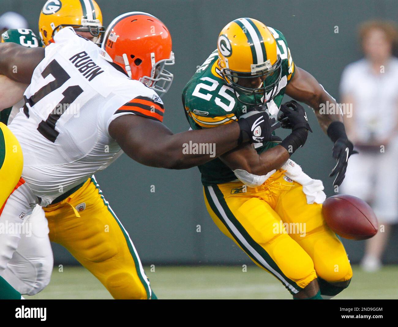 Cleveland Browns' Ahtyba Rubin (71) strips the ball from Green Bay ...