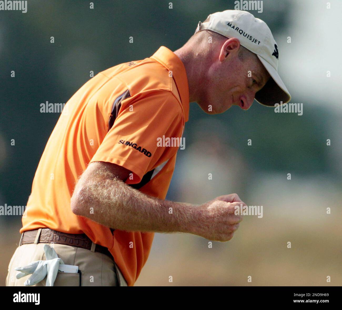 Jim Furyk reacts after making a birdie putt on the 10th hole during the ...