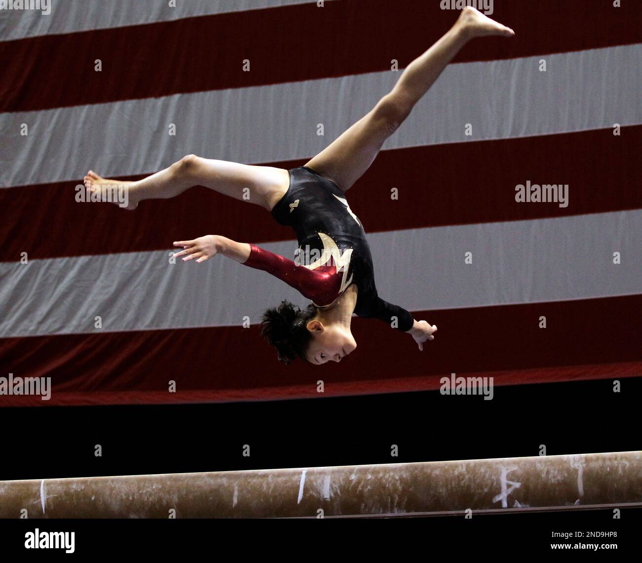 Kyla Ross competes on the balance beam during the women's junior ...