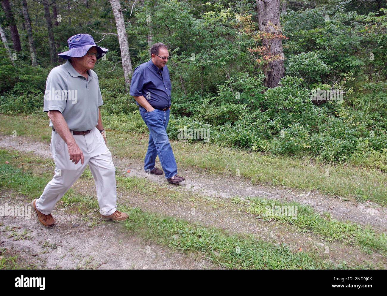 John Browning, left, head of the Waltham Land Trust walks with Rev ...
