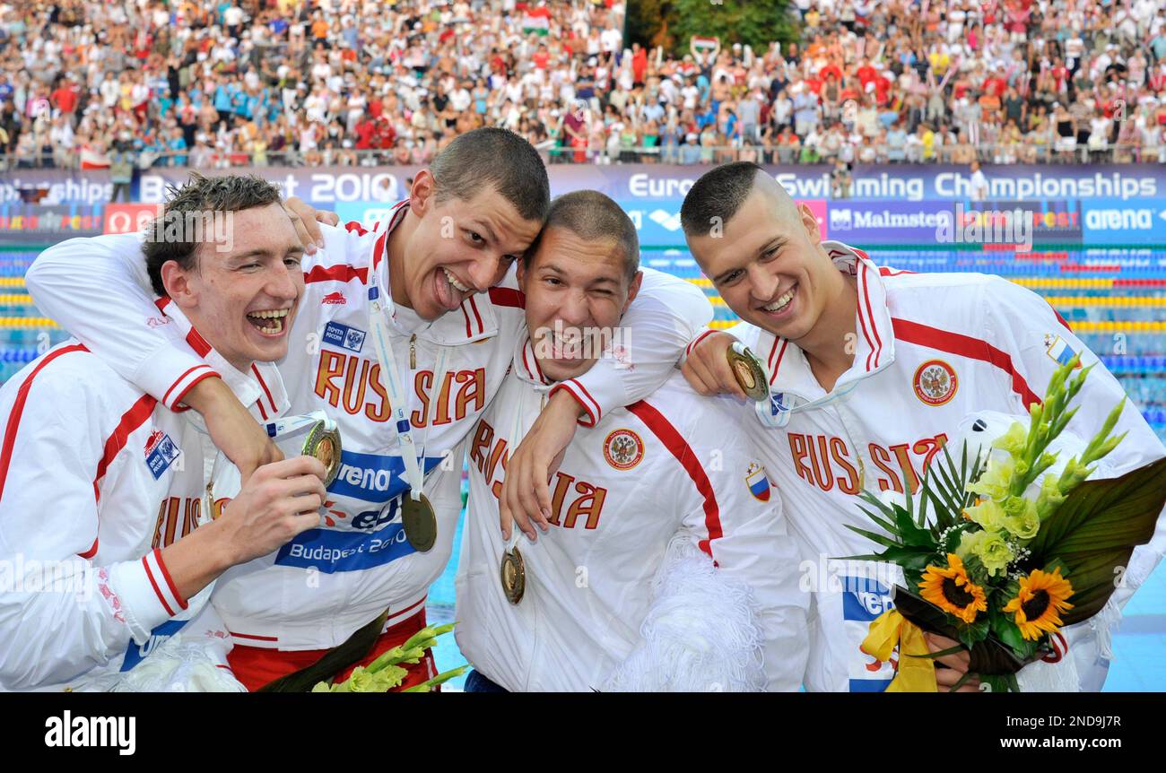 Russia's gold medal winner team show off their medals after the ...