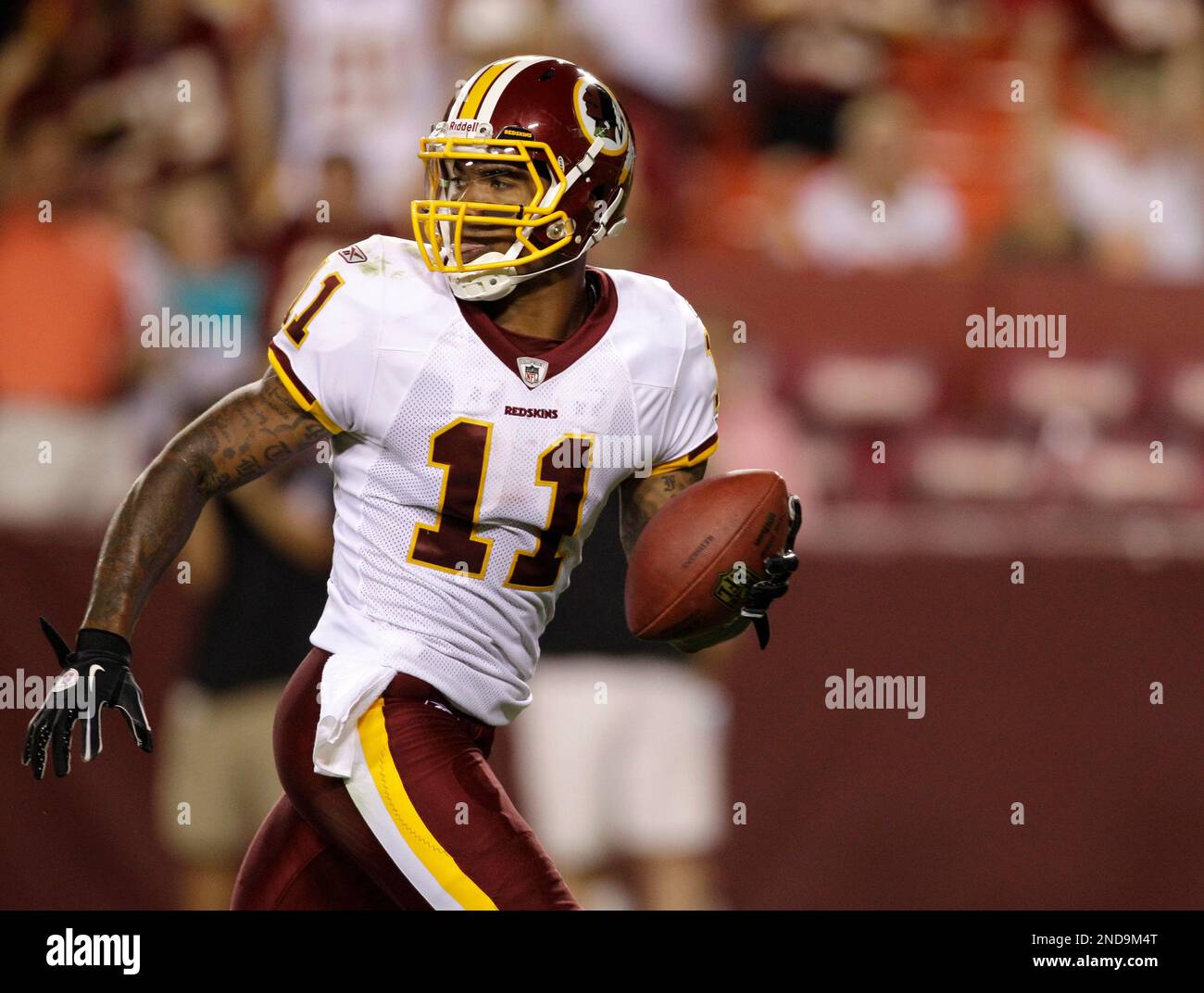 Washington Redskins wide receiver Devin Thomas looks back after ...