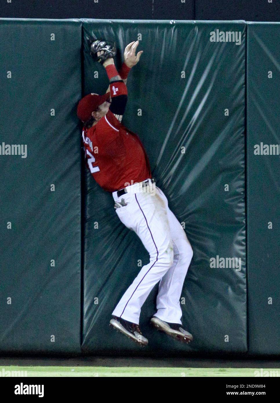 Texas Rangers center fielder Josh Hamilton slams against the wall ...