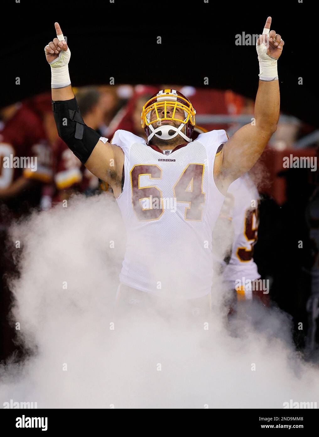 Washington Redskins defensive tackle Kedric Golston pumps up the crowd ...