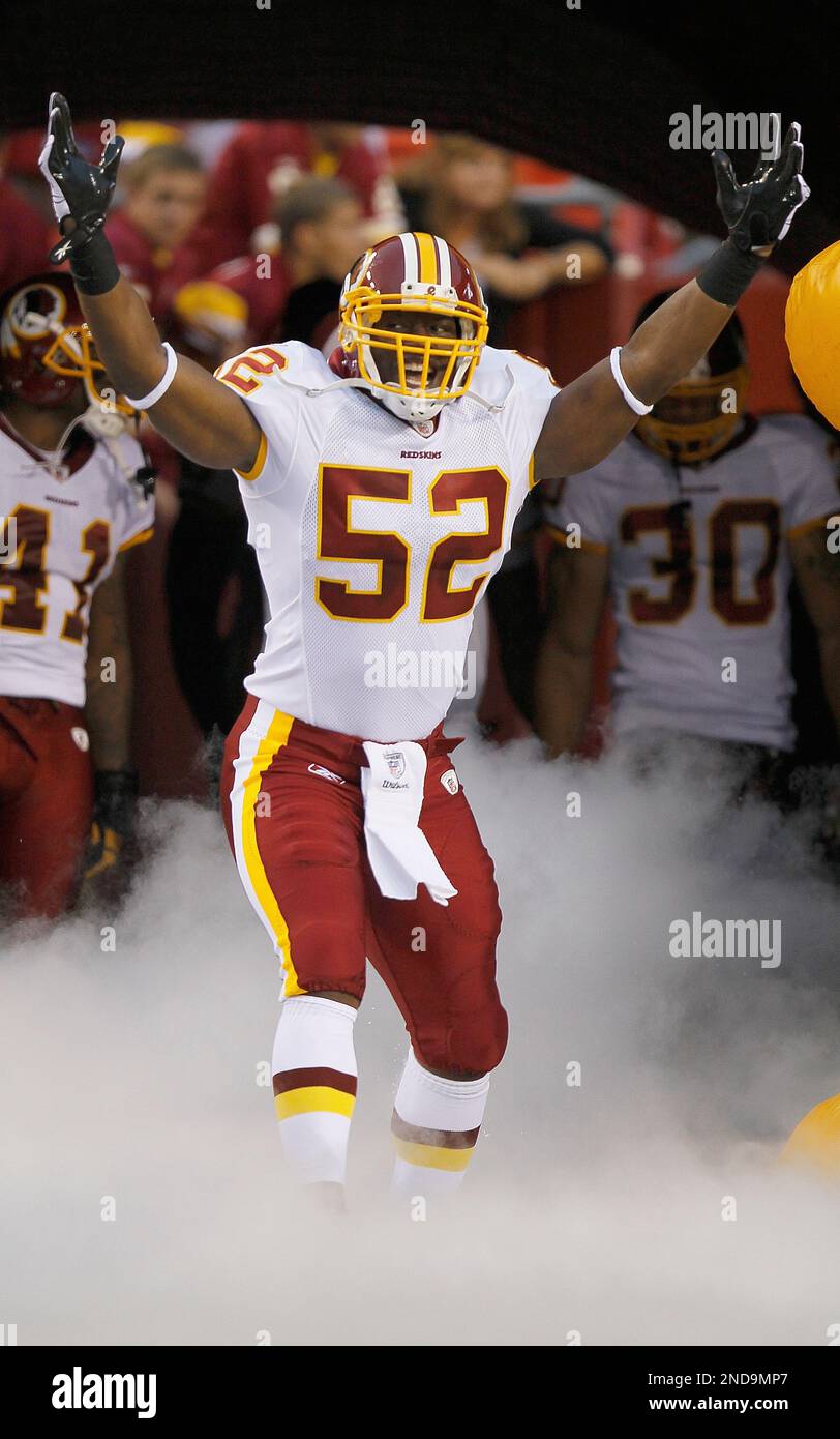 Washington Redskins linebacker Rocky McIntosh pumps up the crowd as he ...