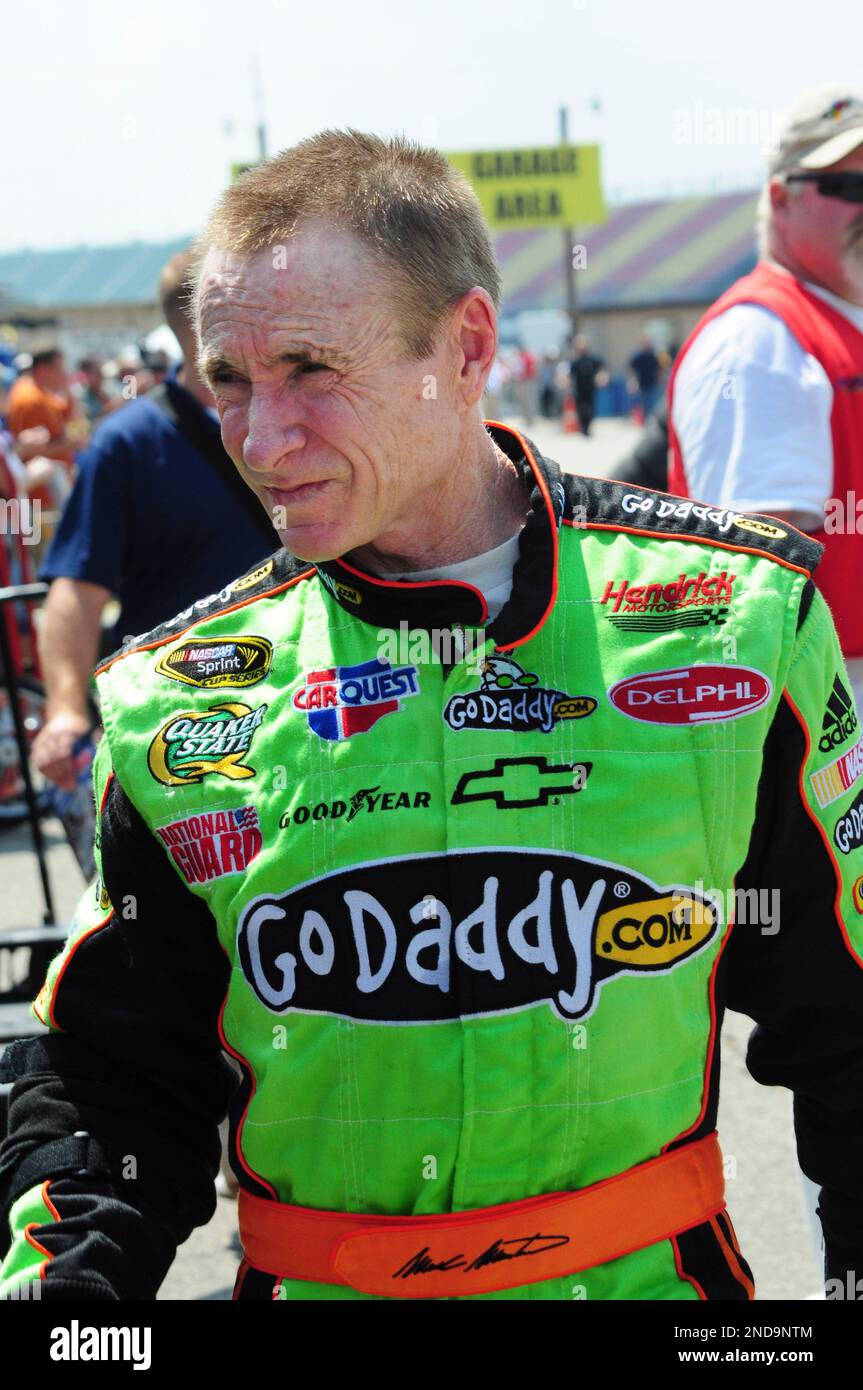 NASCAR driver Mark Martin walks in the garage area at Michigan ...