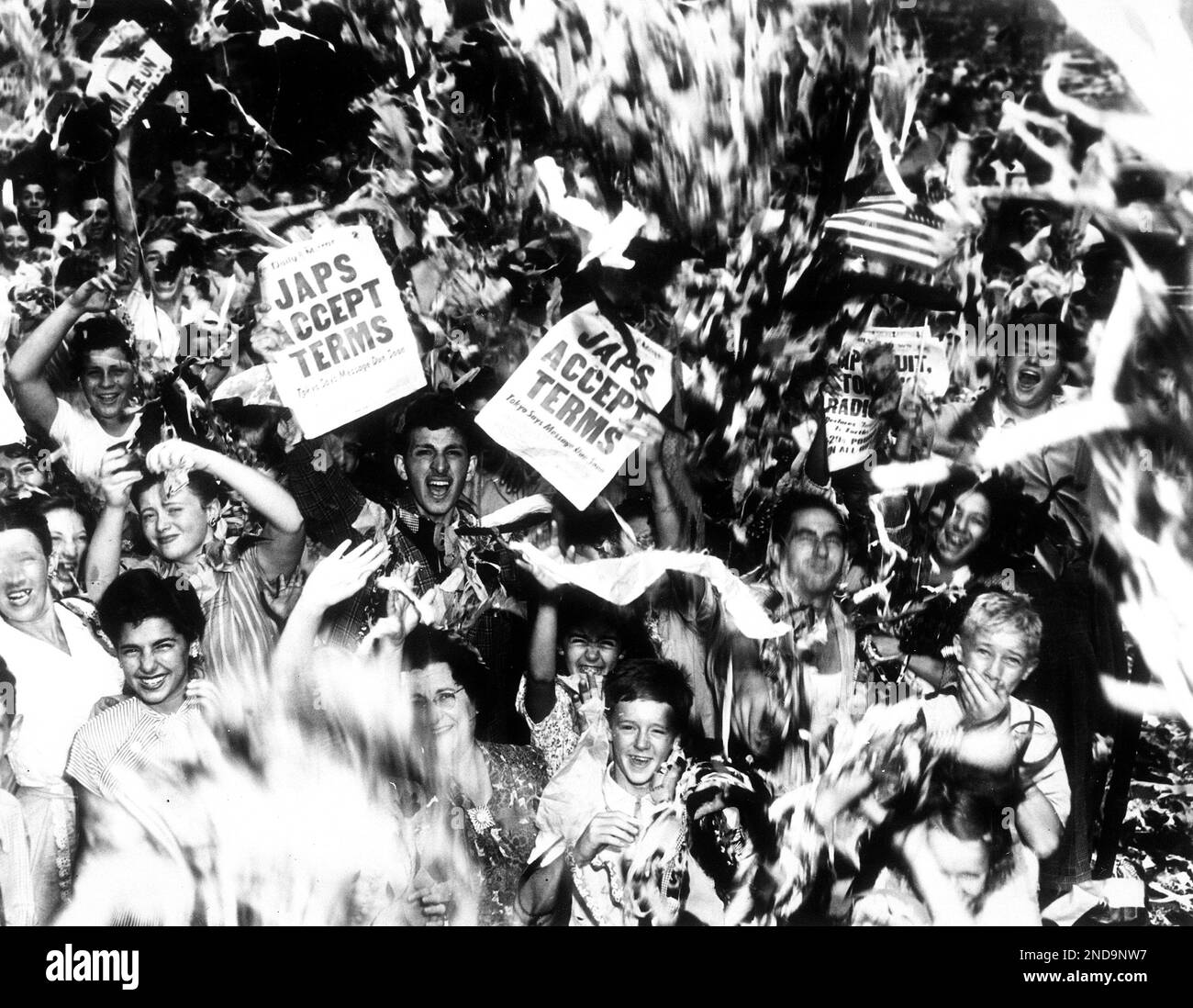FILE - In this Tuesday, Aug. 14, 1945 picture, civilians and service ...