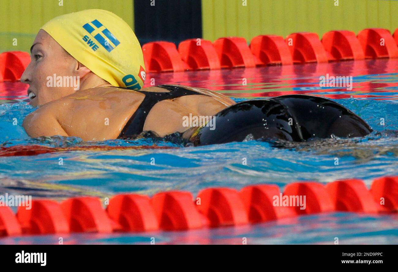 Bronze medal winner Sweden's Therese Alshammar leaves the pool after ...