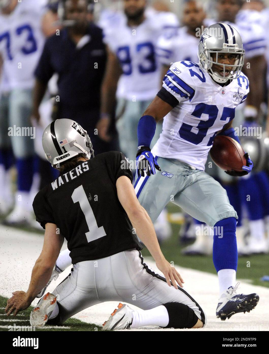 Dallas Cowboys cornerback Bryan McCann is driven out of bounds by ...