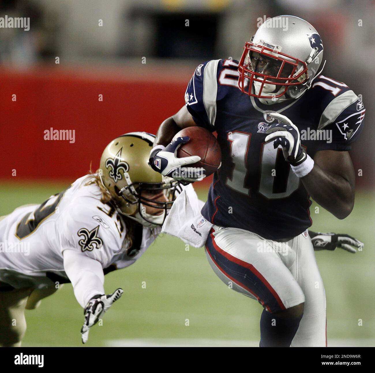New England Patriots' Darnell Jenkins, right, runs past New Orleans ...