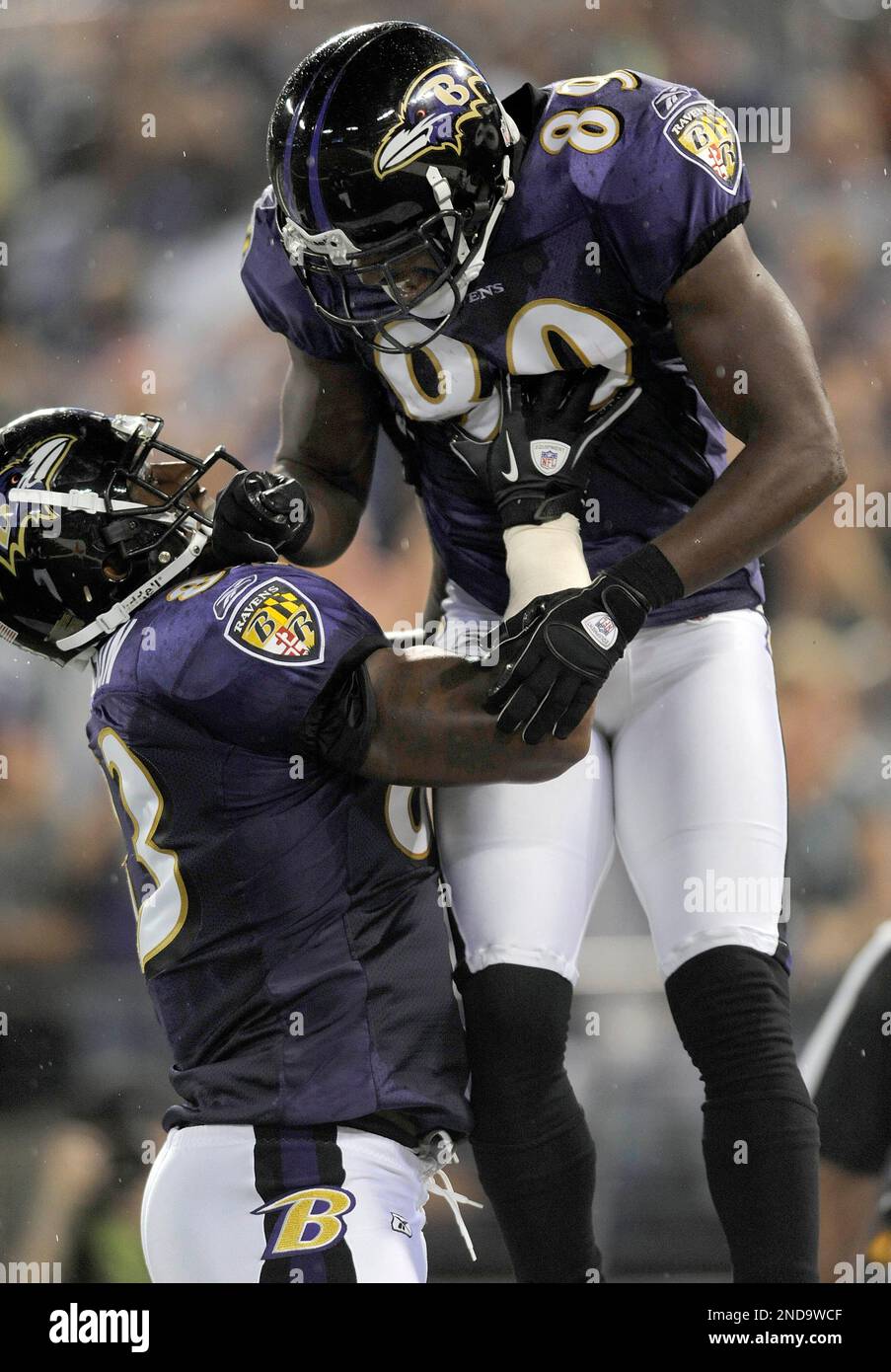Baltimore Ravens tight end Ed Dickson picks up wide receiver Mark ...