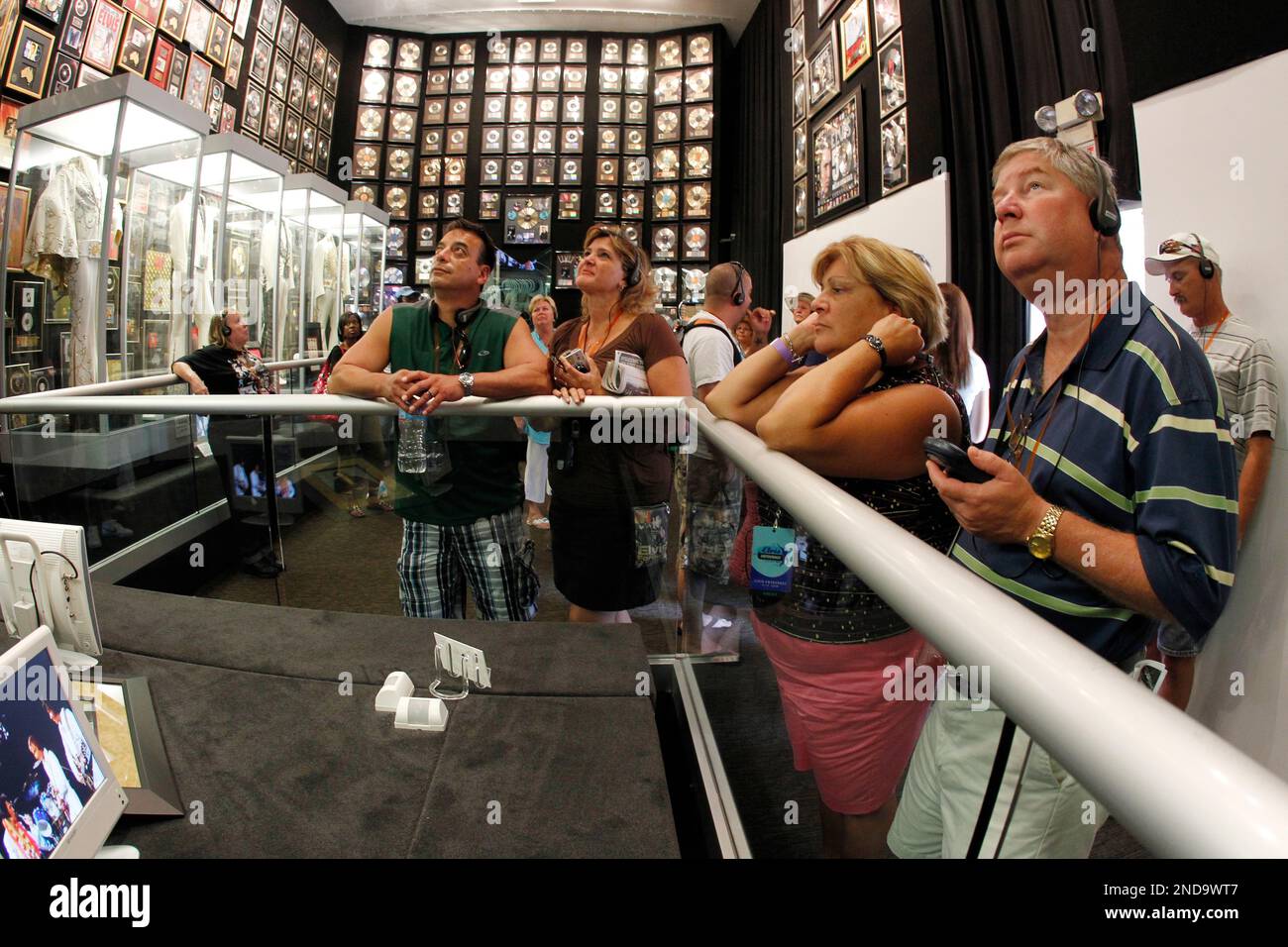 Fans tour the trophy room at Graceland, Elvis Presley's Memphis home ...