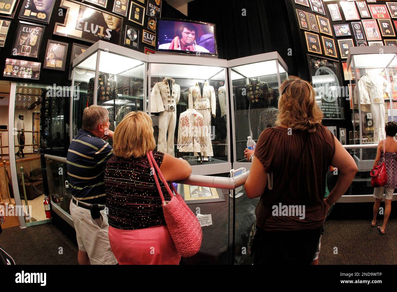Fans tour the trophy room at Graceland, Elvis Presley's Memphis home ...