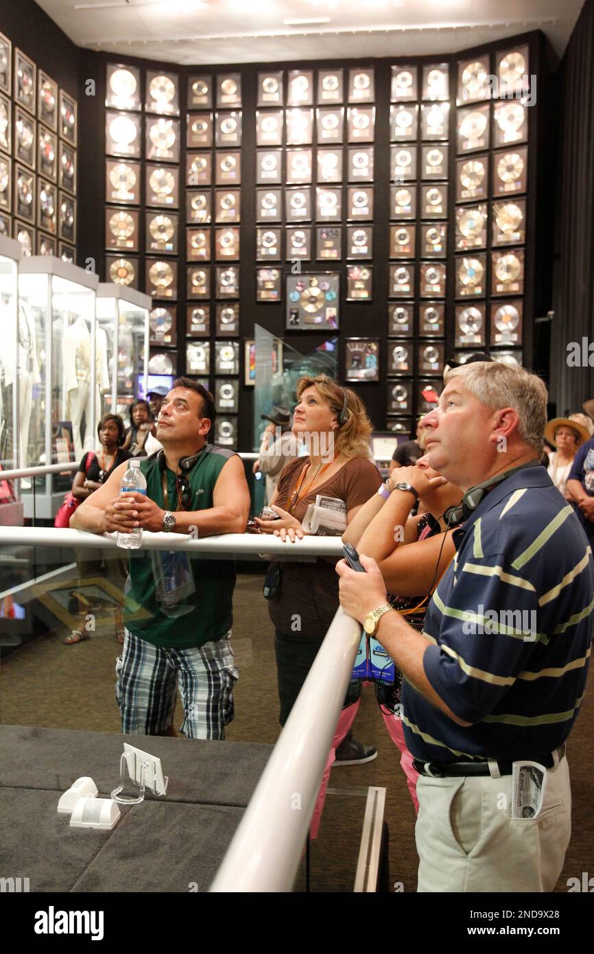 Fans tour the trophy room at Graceland, Elvis Presley's Memphis home ...