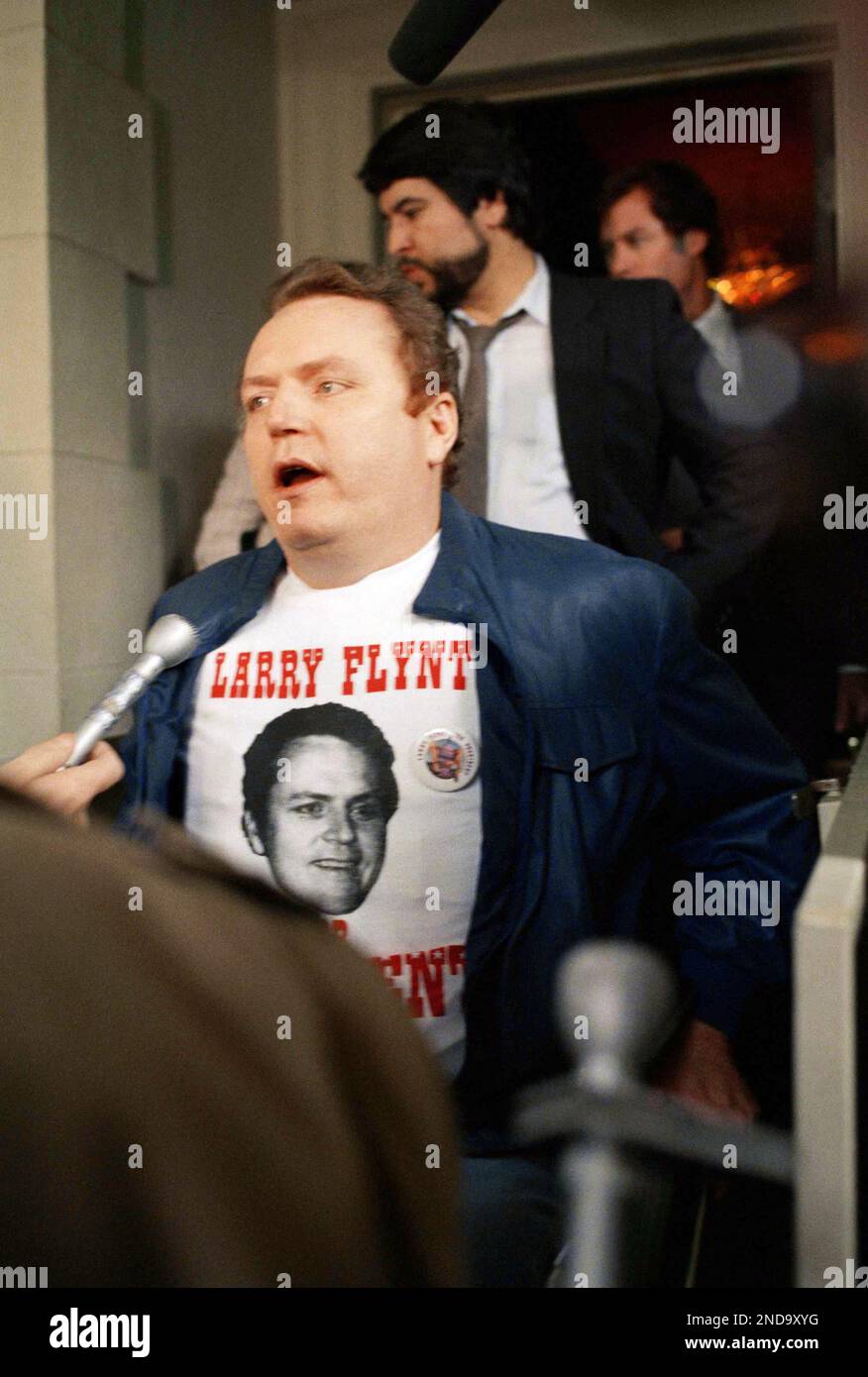 Magazine publisher Larry Flynt is shown under arrest over his ownership ...