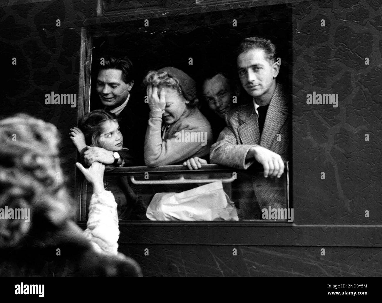 A Hungarian woman cries bitterly as friends bid her goodbye at Vienna’s ...