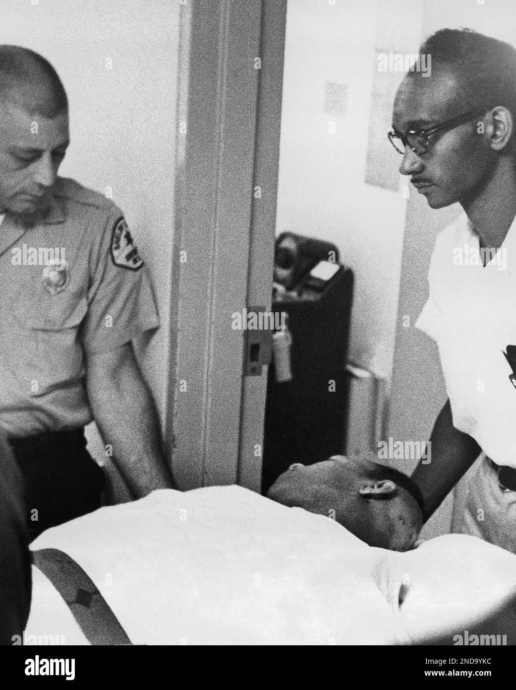 James Meredith, with head shaven, is moved from the emergency room at a ...