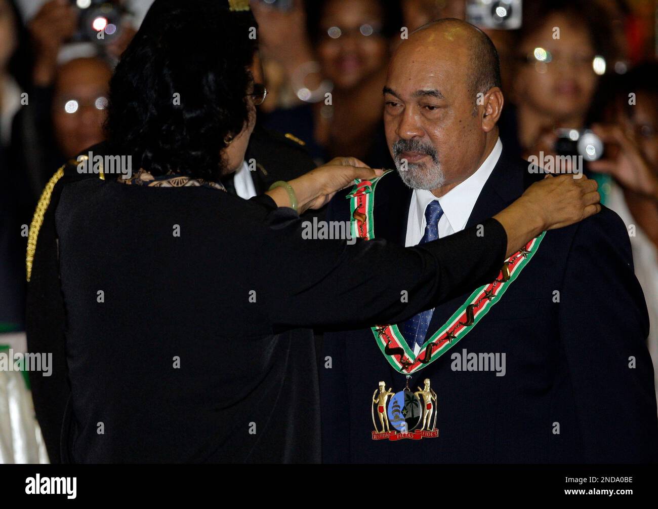 Suriname's Parliament Speaker Jennifer Simons-Geerlings, left, adjusts ...