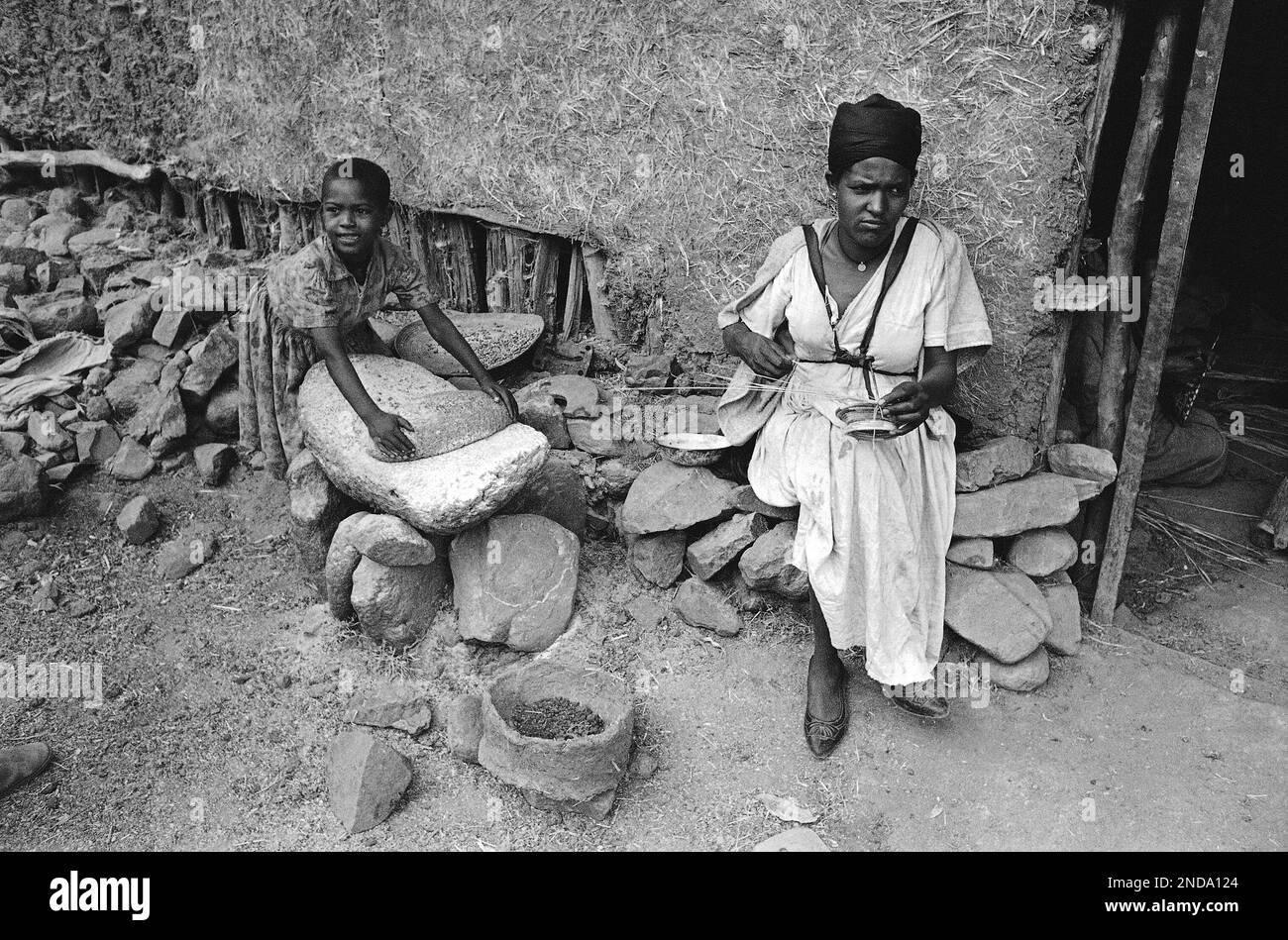 A Falasha woman of Ethiopia’s tribe of “black Jews” sits outside her ...