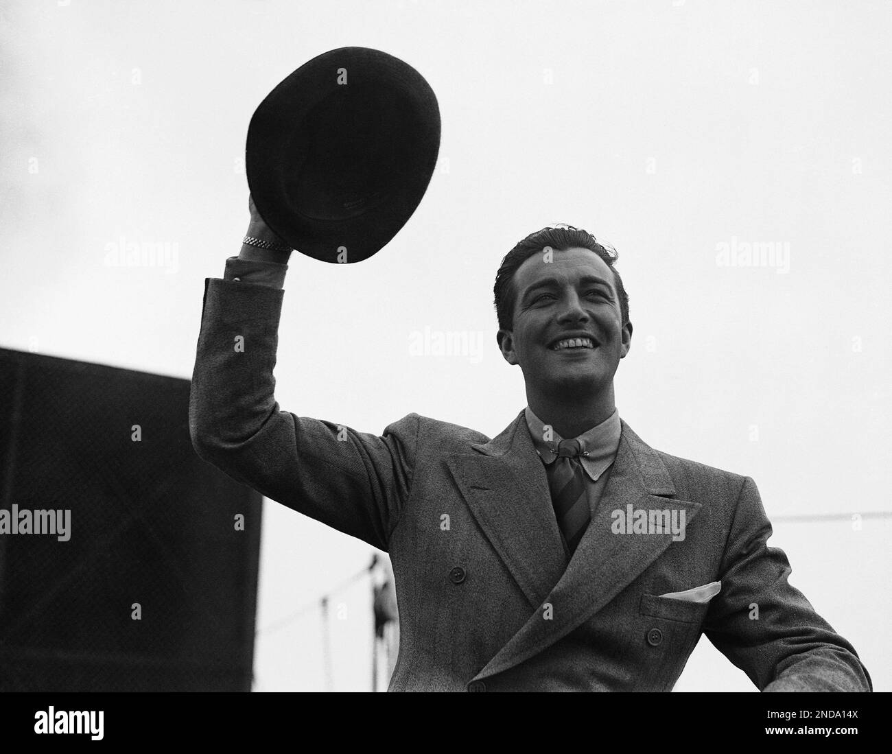 Actor Robert Taylor, waving as he arrived in Southampton, England on ...