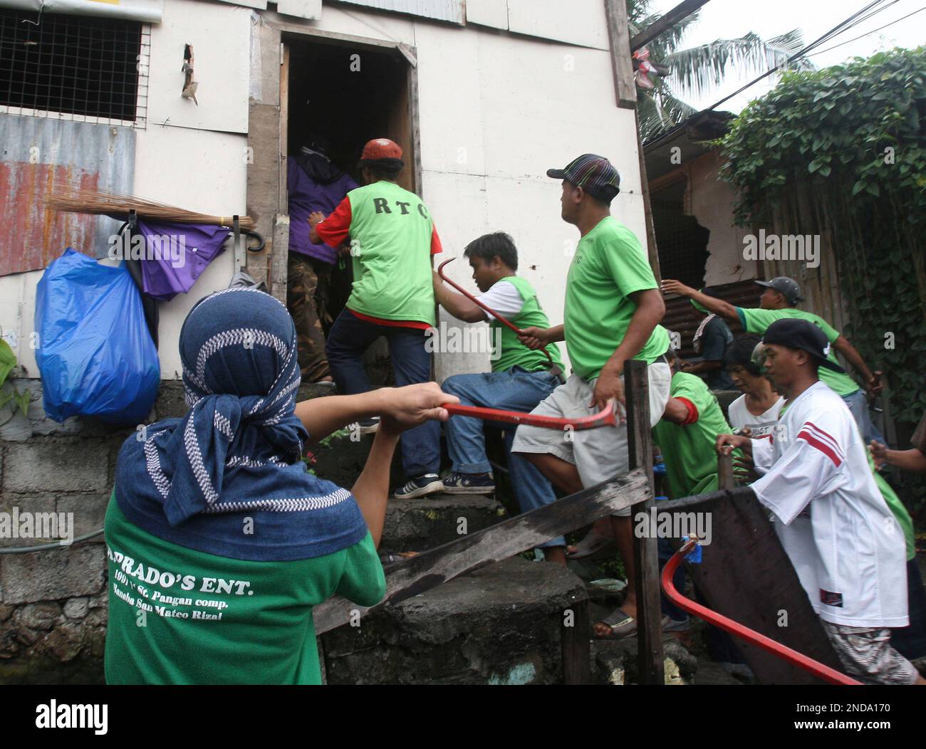Demolition crew rush to demolish shanties after being cleared by police ...
