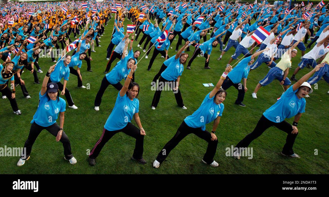 Thai people do mass aerobic exercise at National Stadium in Bangkok ...