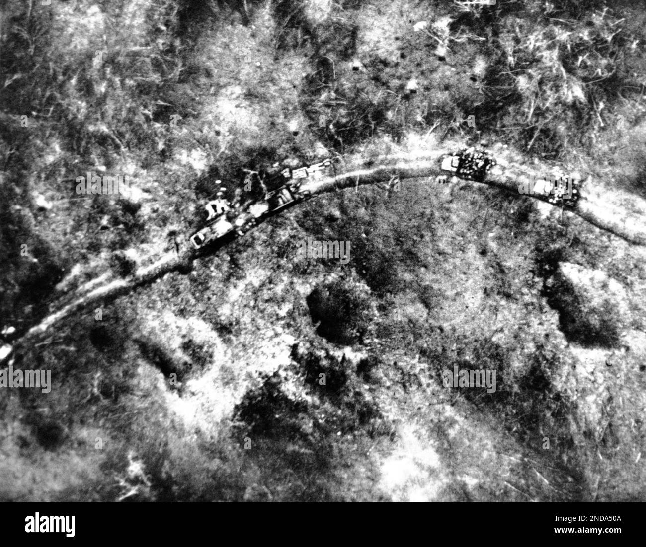 Trucks which were destroyed as they moved along the Ho Chi Minh trail ...
