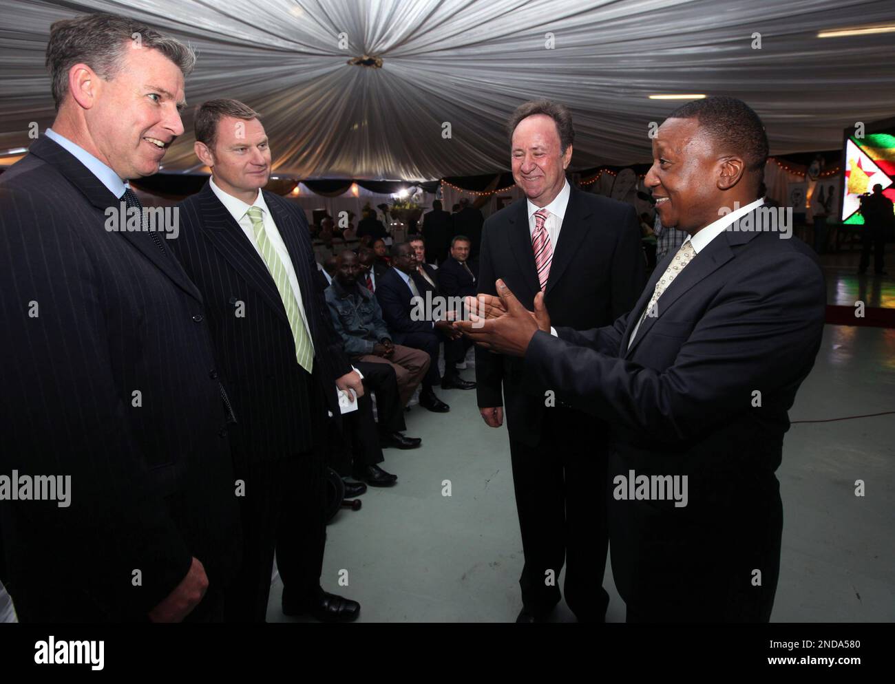 Abbey Chikane of Kimberley Process, right, chats to diamond buyers and ...