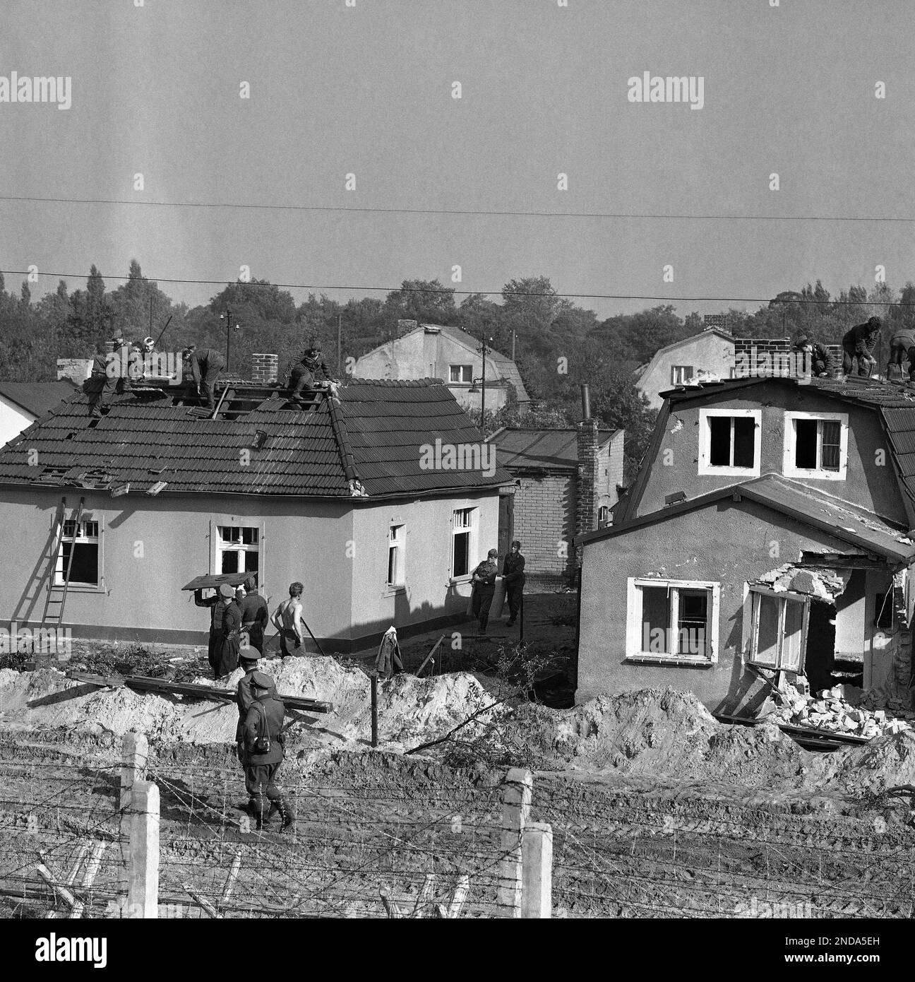 Working holding fence roof architecture hi-res stock photography and ...