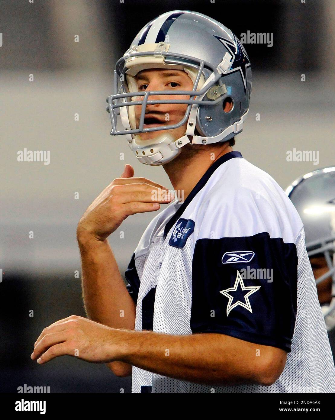 Dallas Cowboys quarterback Tony Romo gestures to the offensive line ...