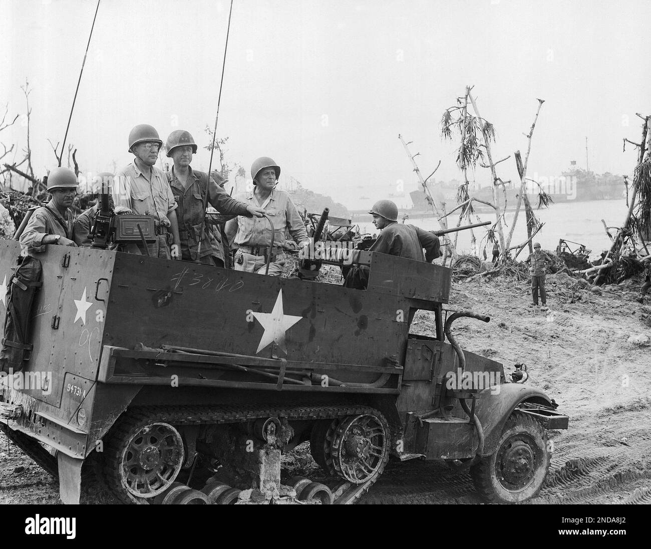 Maj. Gen. Julian C. Smith (standing, left) commander of the ...