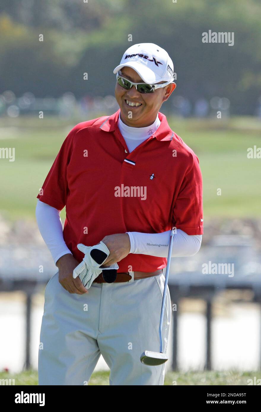 Toru Taniguchi of Japan smiles during a practice round for the U.S ...
