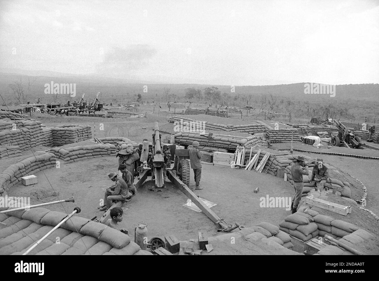 South vietnamese first division artillery men take a break out stand near their 105mm howitzer ...