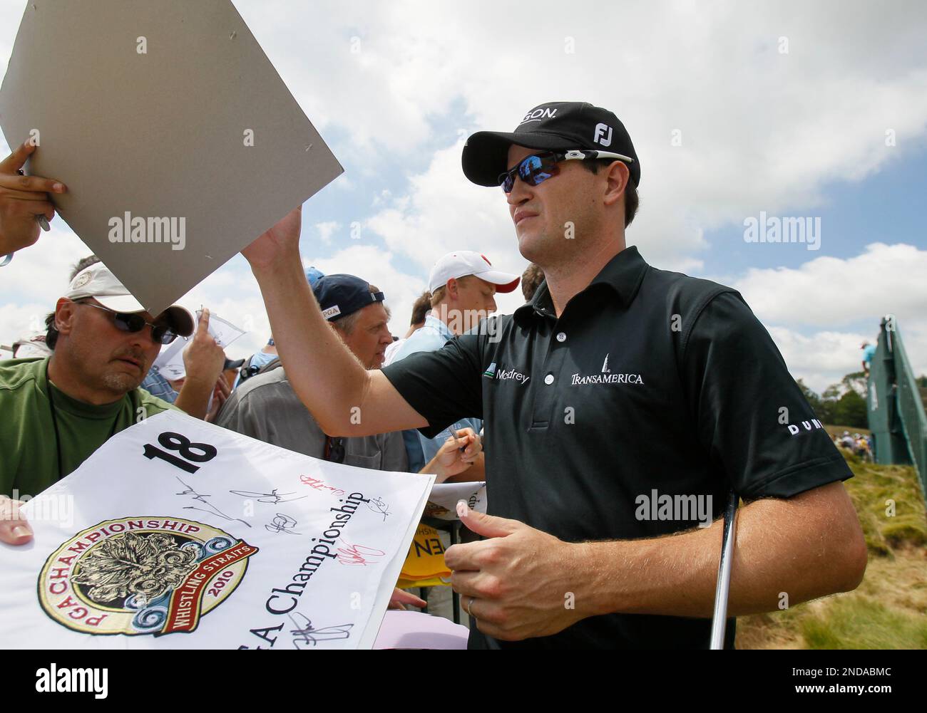 Zach Johnson signs autographs during a practice round for the PGA ...